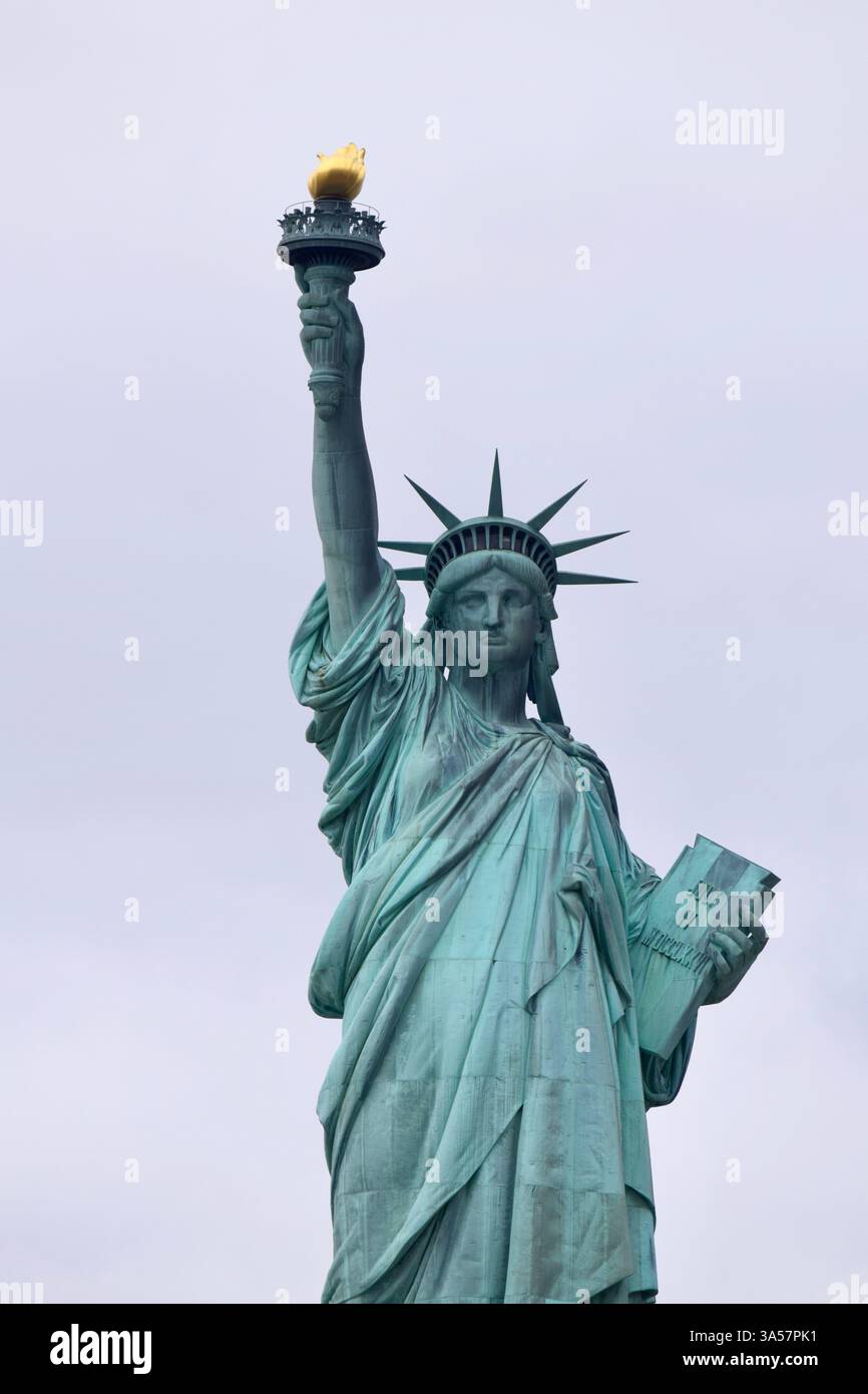 The Statue of Liberty rises majestically over New York Harbor, a ...