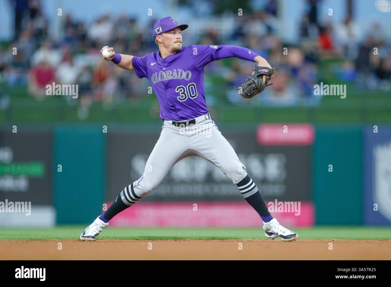 Surprise, AZ. USA; Colorado Rockies shortstop Aaron Schunk (30) throws ...