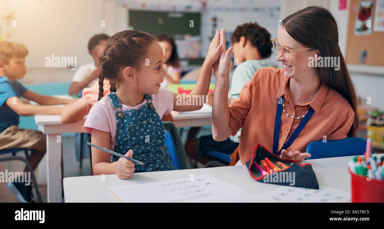 Education, teacher and high five girl in classroom for lesson support ...