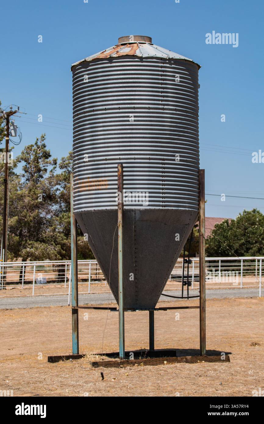 A portable hopper feed bin for livestock on a farm Stock Photo - Alamy