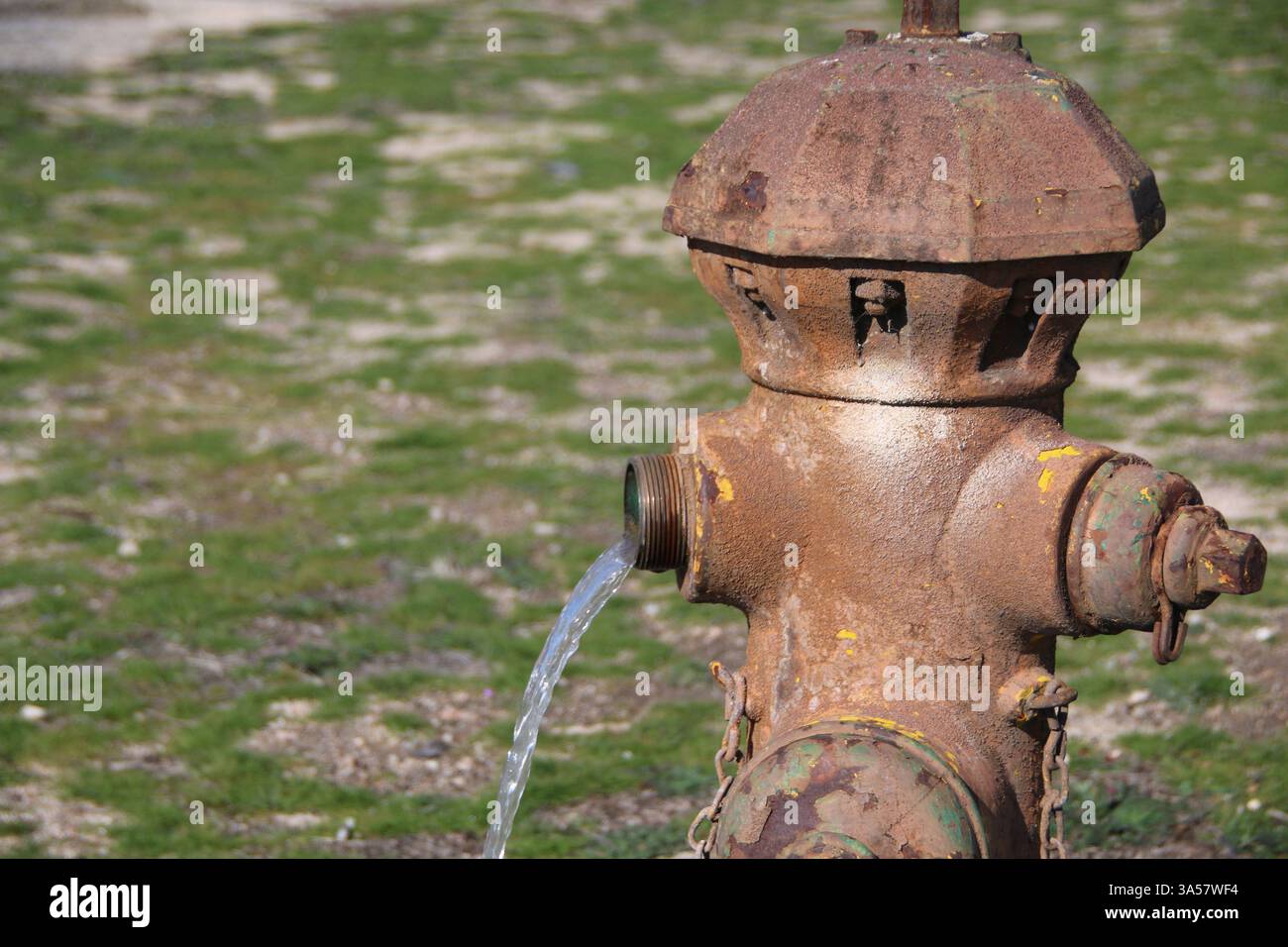 Water flowing out of an old fire hydrant Stock Photo - Alamy