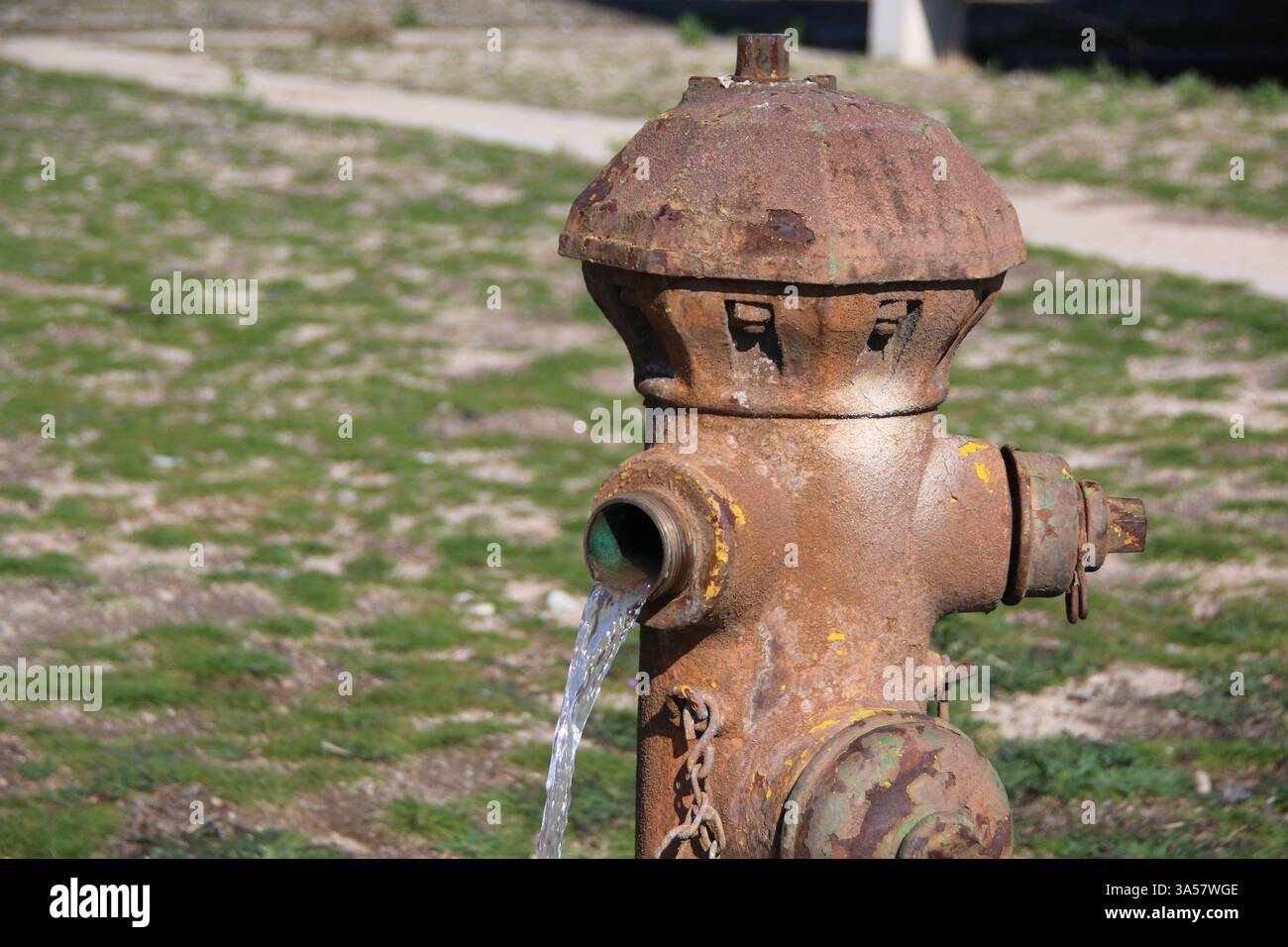 Water flowing out of an old fire hydrant Stock Photo - Alamy