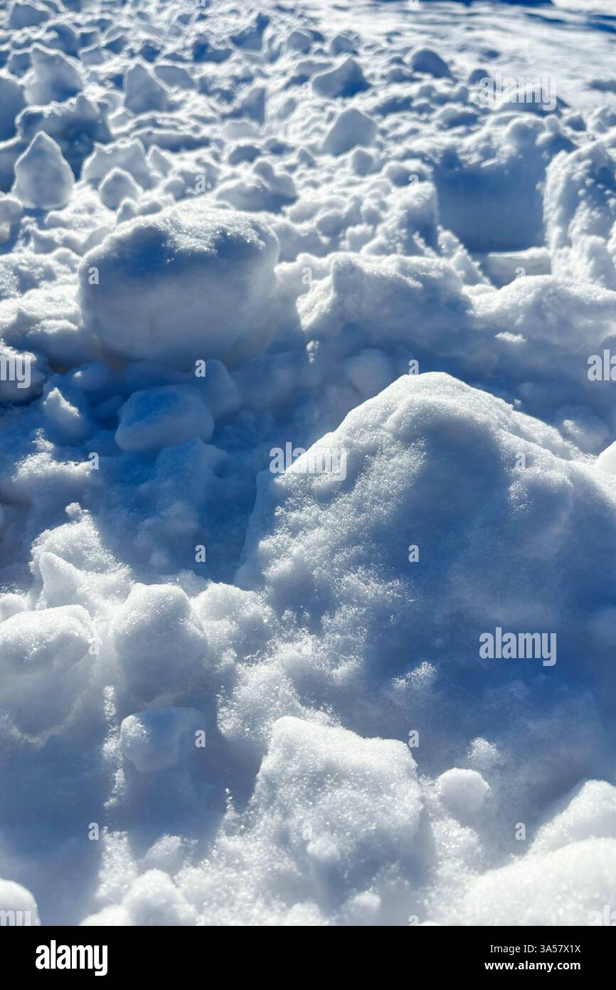 Natural fresh snow texture, snowballs close up, surface of snow crust ...