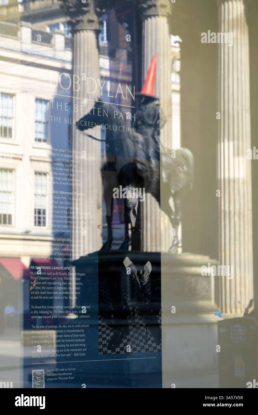Reflection in the window of a gallery selling art by Bob Dylan, Queen ...