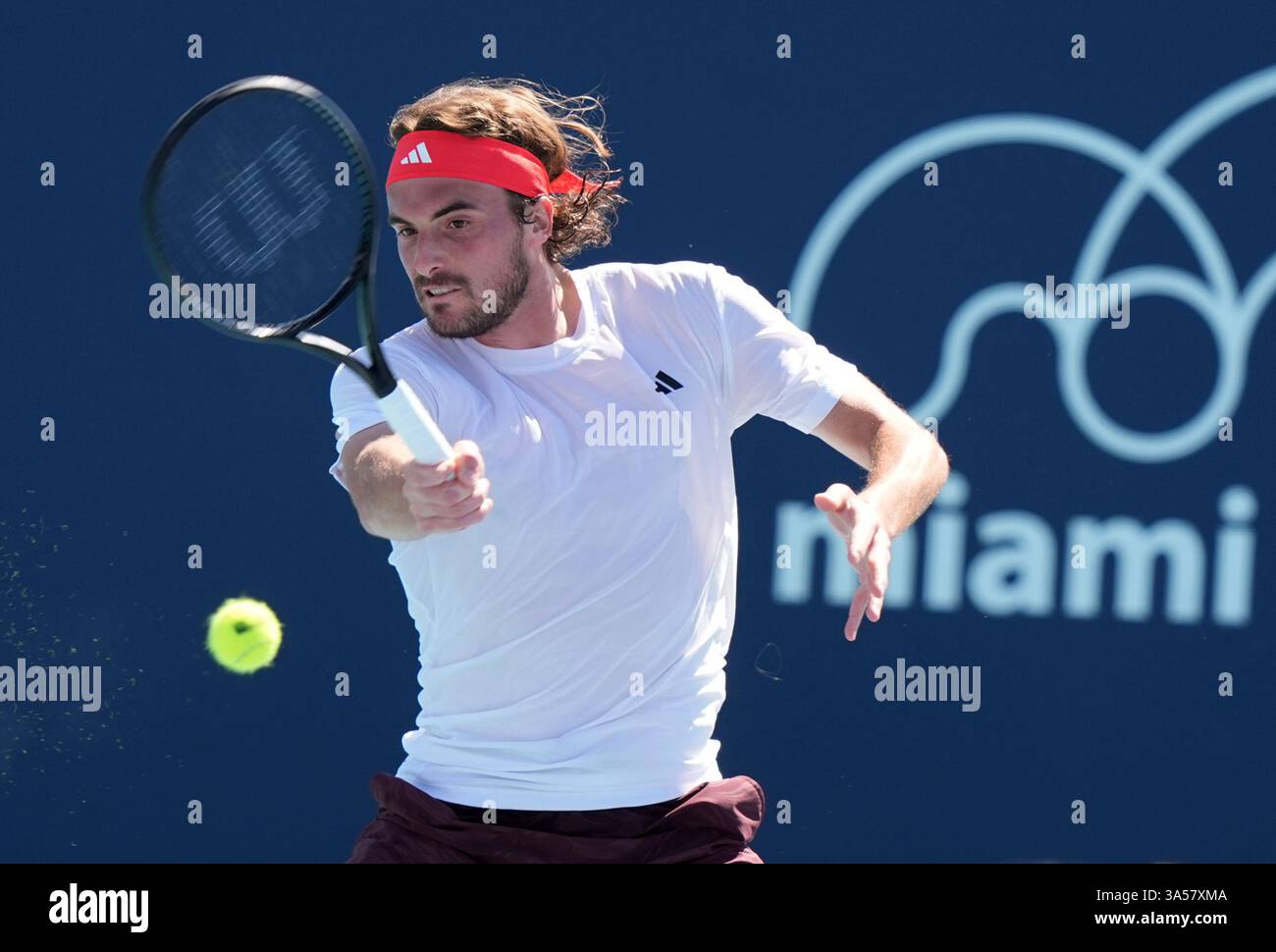 Stefanos Tsitsipas, of Greece, hits a return to Chun-Hsin Tseng, of ...