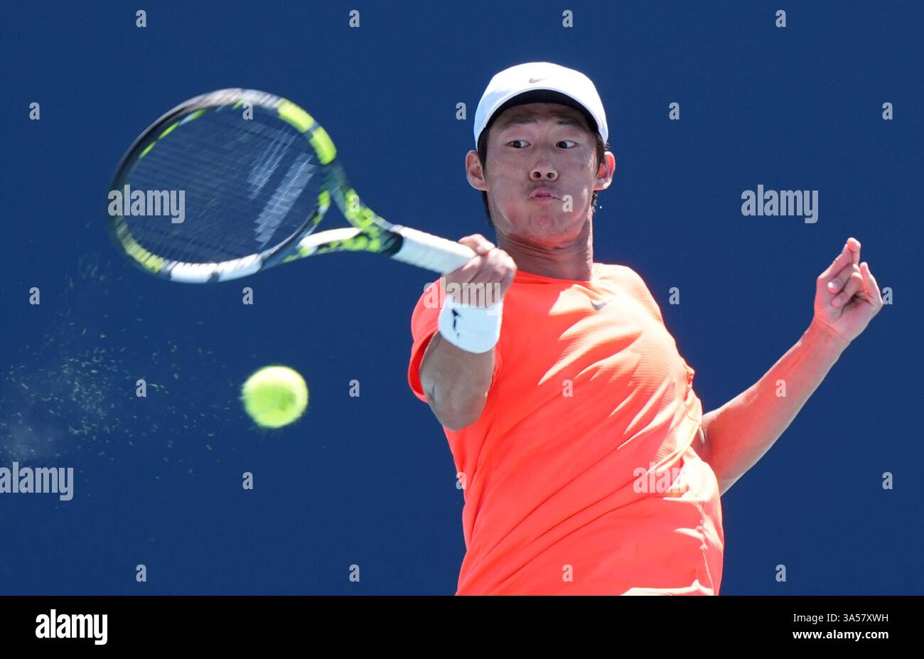 Chun-Hsin Tseng, of Taiwan, hits a return to Stefanos Tsitsipas, of ...