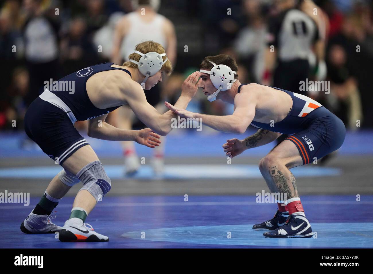 Illinois' Lucas Byrd takes, right, on Penn State's Braeden Davis in ...