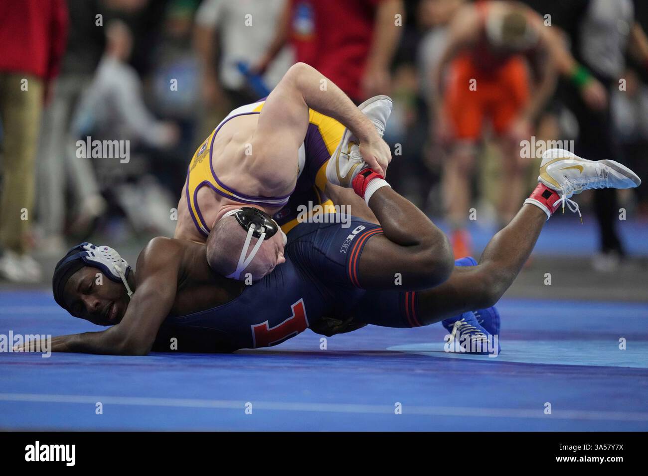 Northern Iowa's Parker Keckeisen, top, takes on Illinois' Edmond Ruth ...