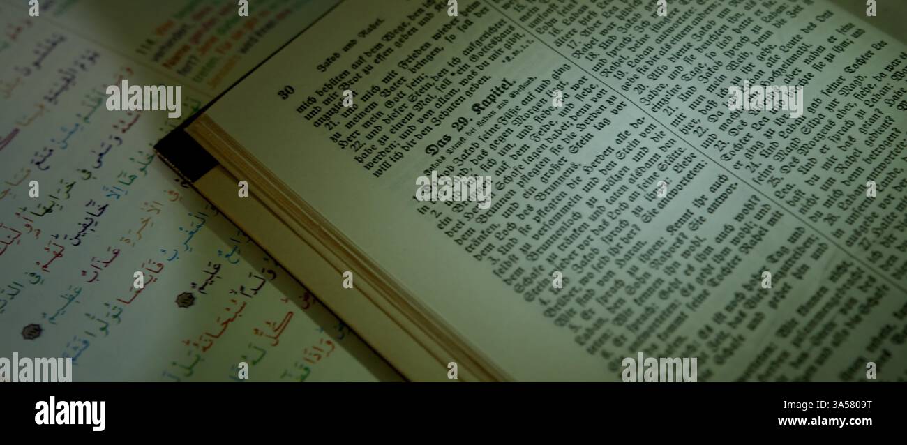 The Quran and the Holy Bible, in mythical light Stock Photo - Alamy