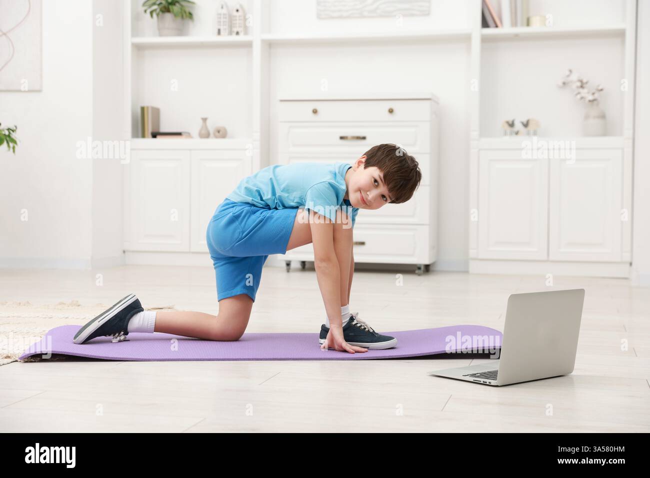 Home online training boy hi-res stock photography and images - Alamy