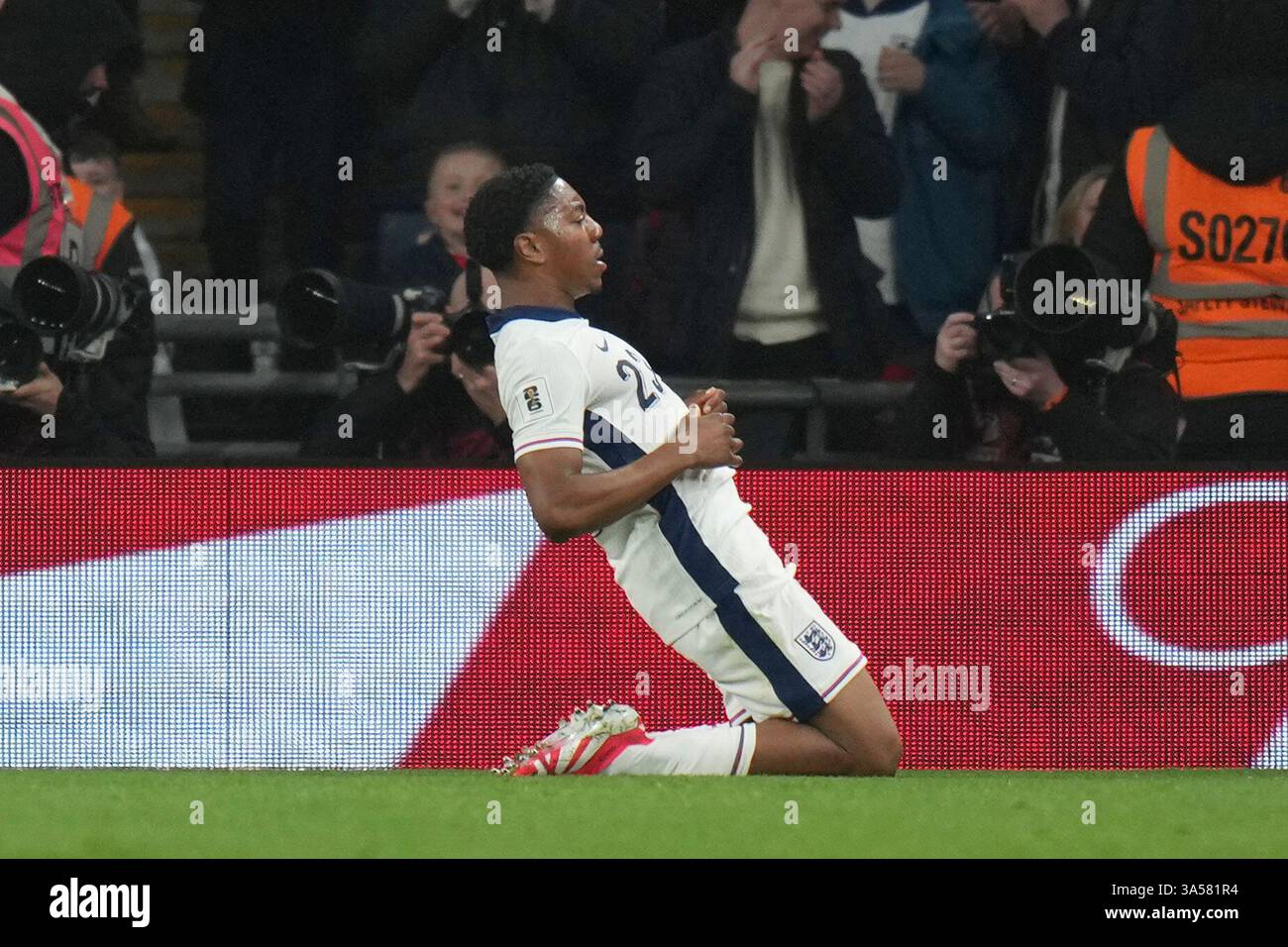 England's Myles Lewis-Kelly celebrates after scoring his side's opening ...