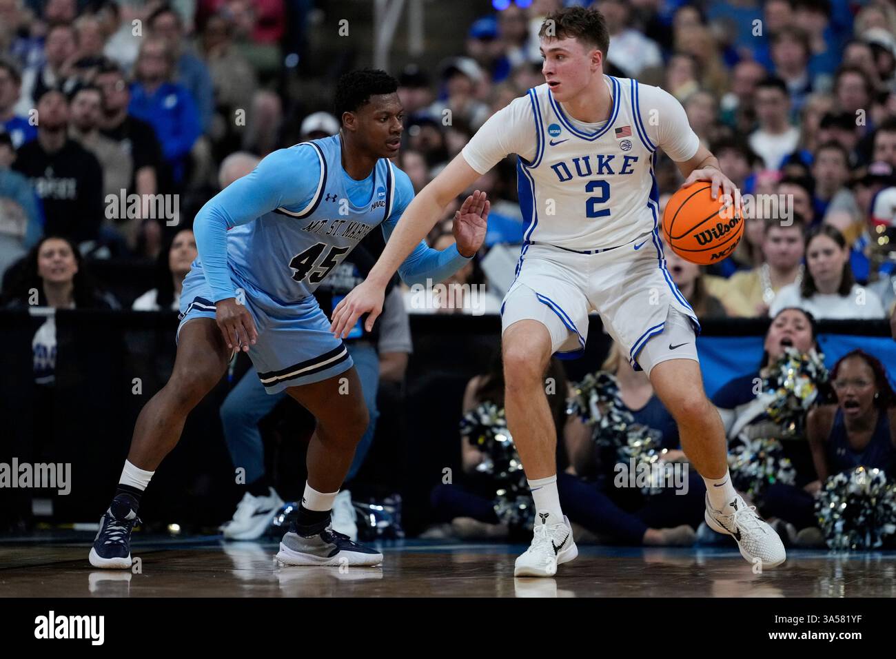 Duke forward Cooper Flagg (2) drives past Mount St. Mary's guard Xavier Lipscomb (45) during the ...