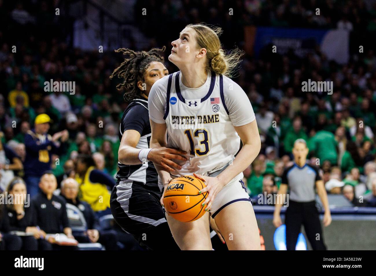 Notre Dame forward Kate Koval (13) looks to shoot as Stephen F. Austin ...