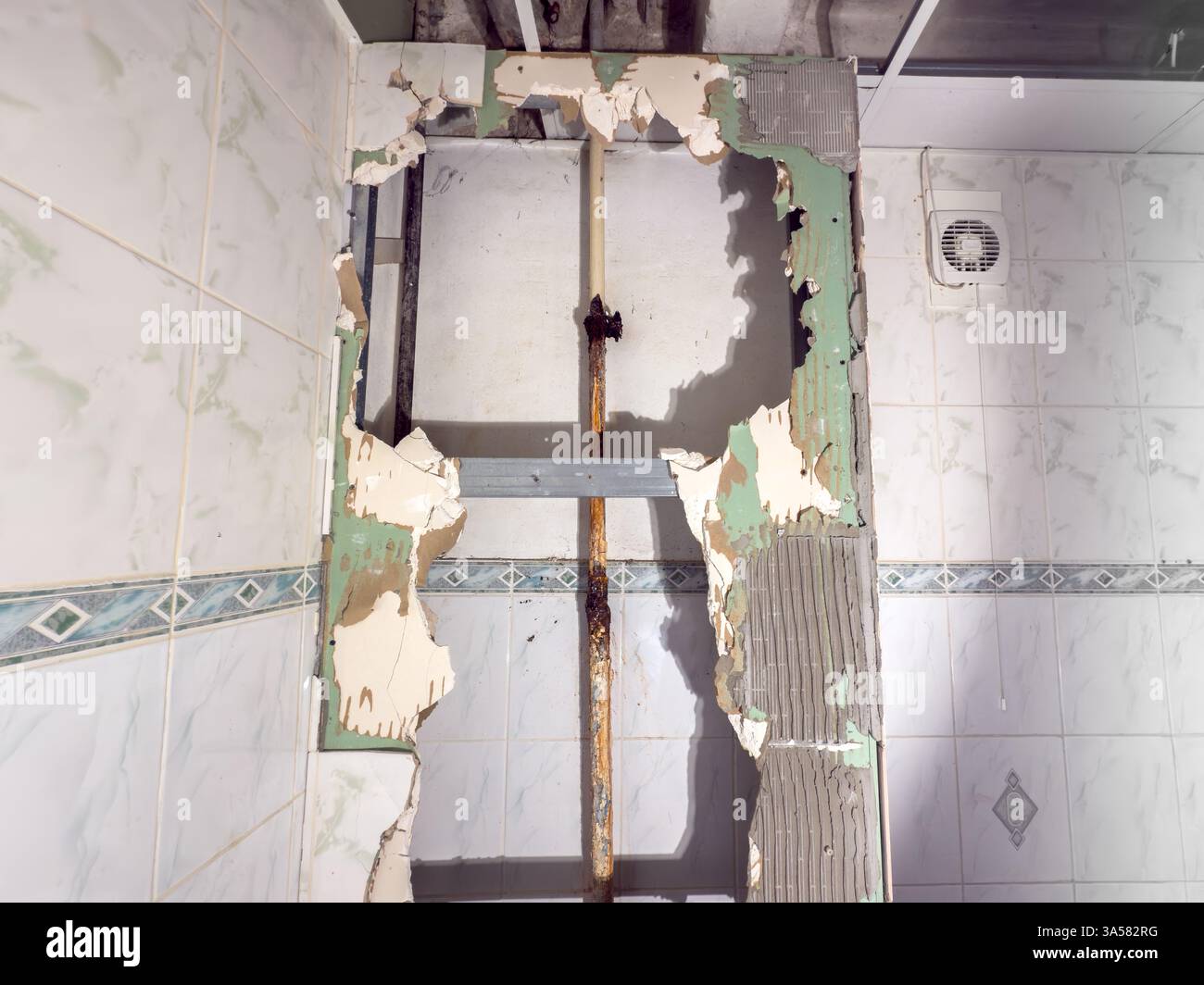 A detailed closeup view of a wall that has been significantly damaged ...