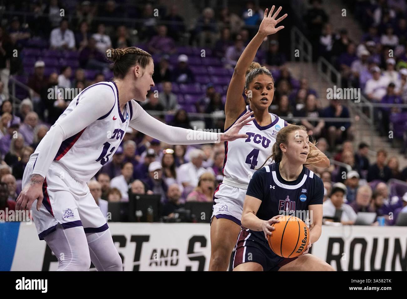 TCU guard Donovyn Hunter, right, looks to make a pass as TCU's Sedona Prince, left, and Donovyn ...
