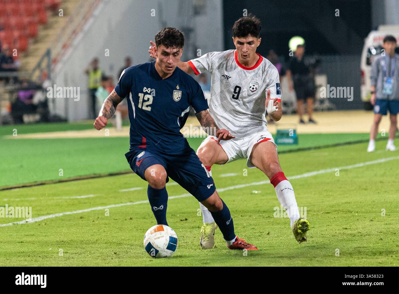 Nicholas Mickelson #12 of Thailand and Omid Musawi #9 of Afghanistan ...