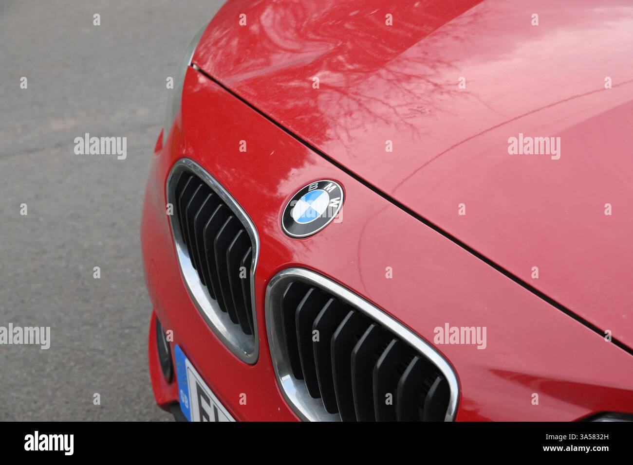 BMW Badge Emblem on a Red Car Stock Photo - Alamy