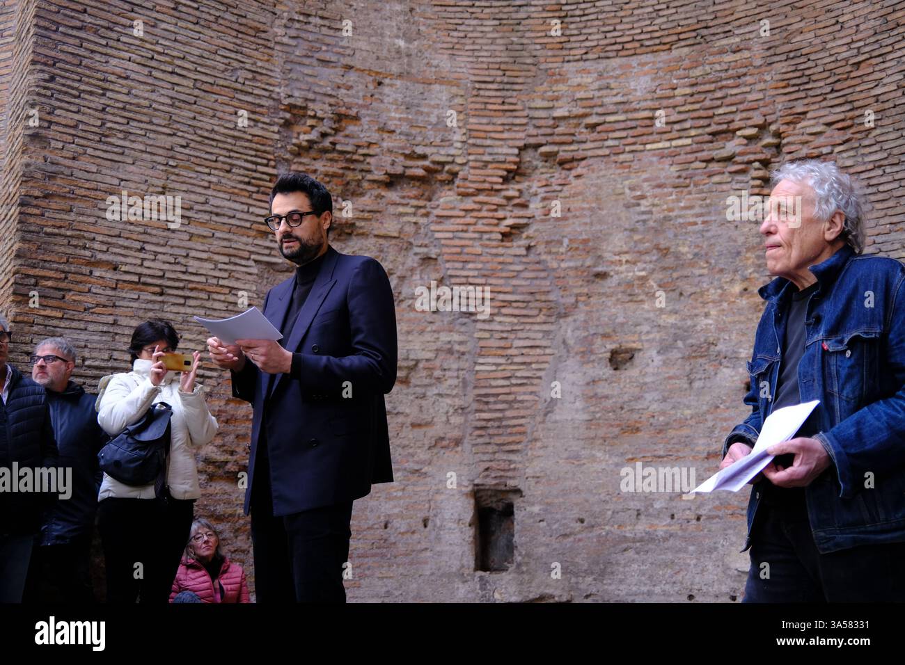 Rome, Italy. 21st Mar, 2025. Gabriele Tinti observes as Abel Ferrara ...