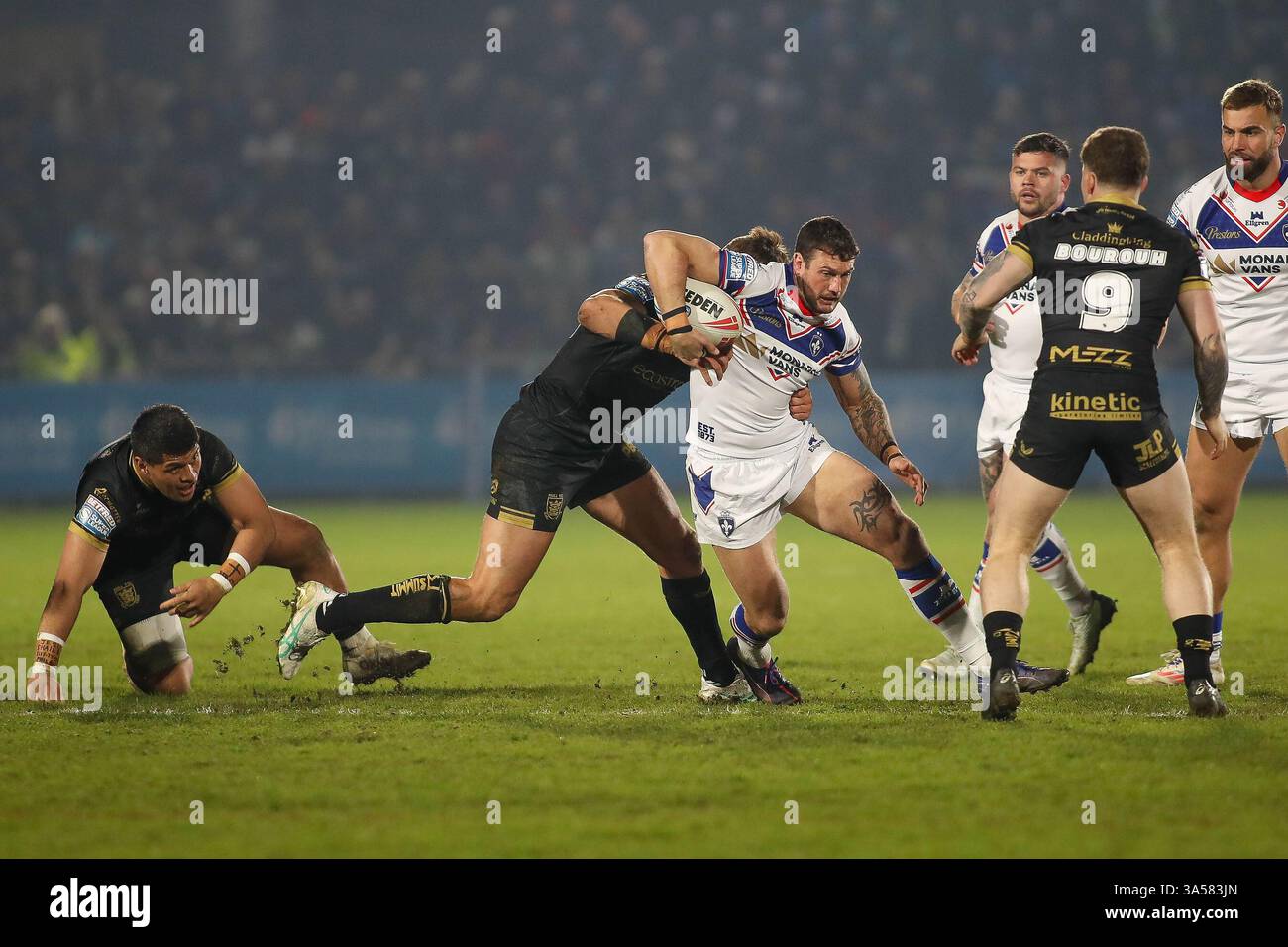 Jay Pitts looks to break away from a Hull defender*** during the Super ...