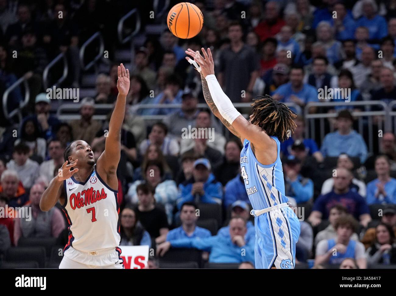 North Carolina guard RJ Davis (4) scores a three point basket against ...