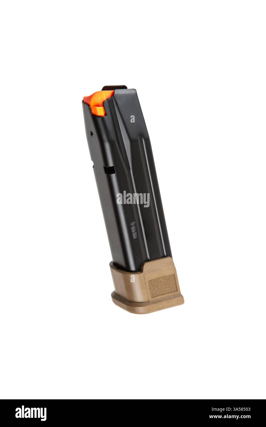 A black and tan pistol magazine with an orange follower, featuring a ...