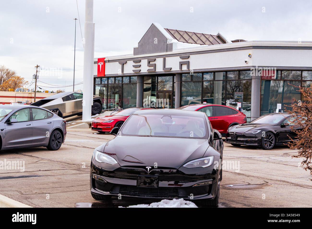 Salt Lake City, UT, US-March 20, 2025: Tesla dealership with several ...