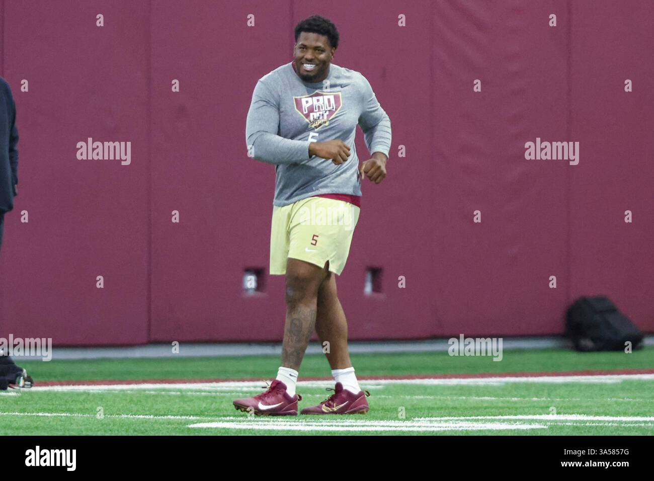 Florida State defensive lineman Joshua Farmer stretches during the ...