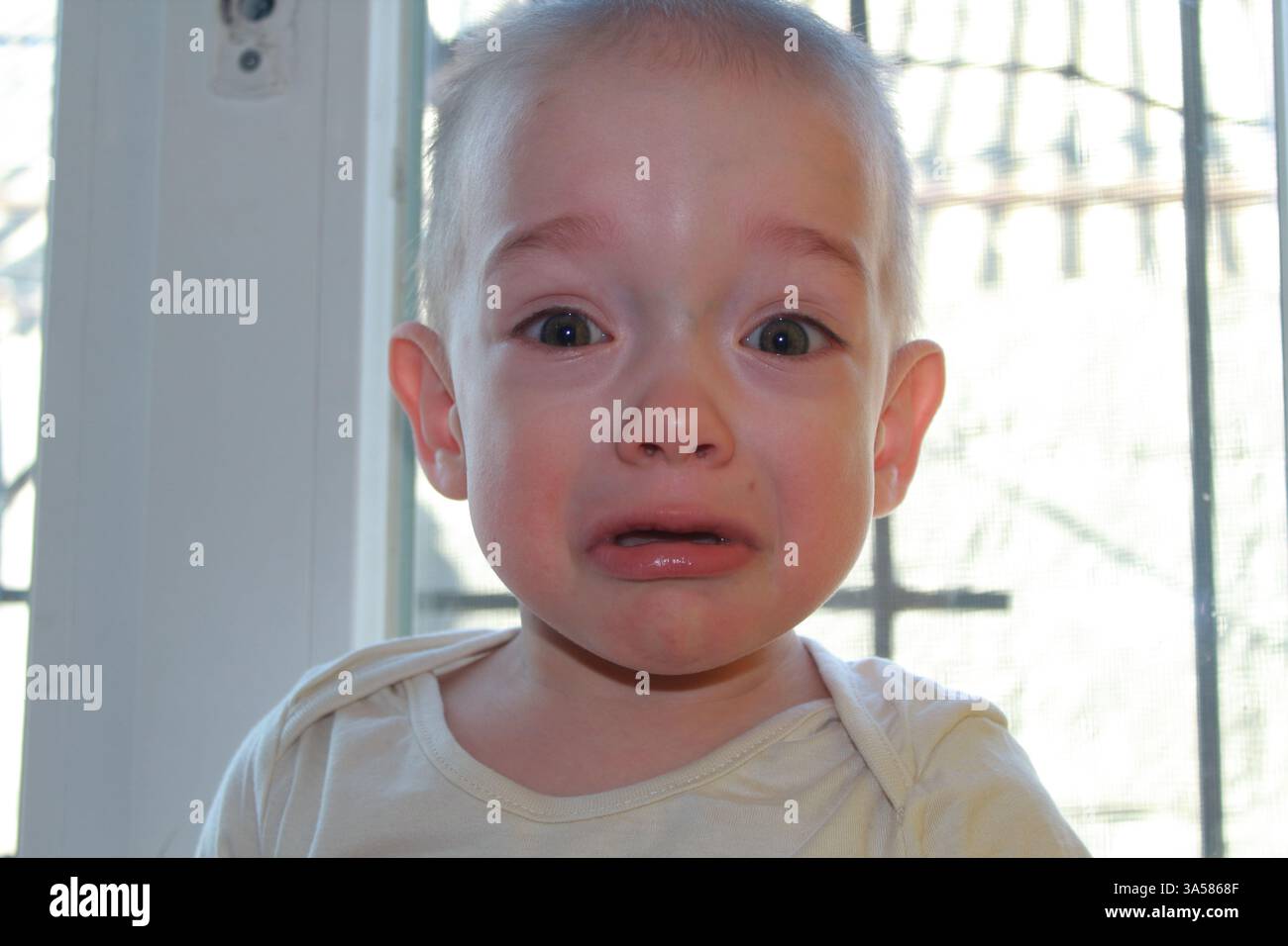 Baby boy crying . Emotional child close up Stock Photo - Alamy