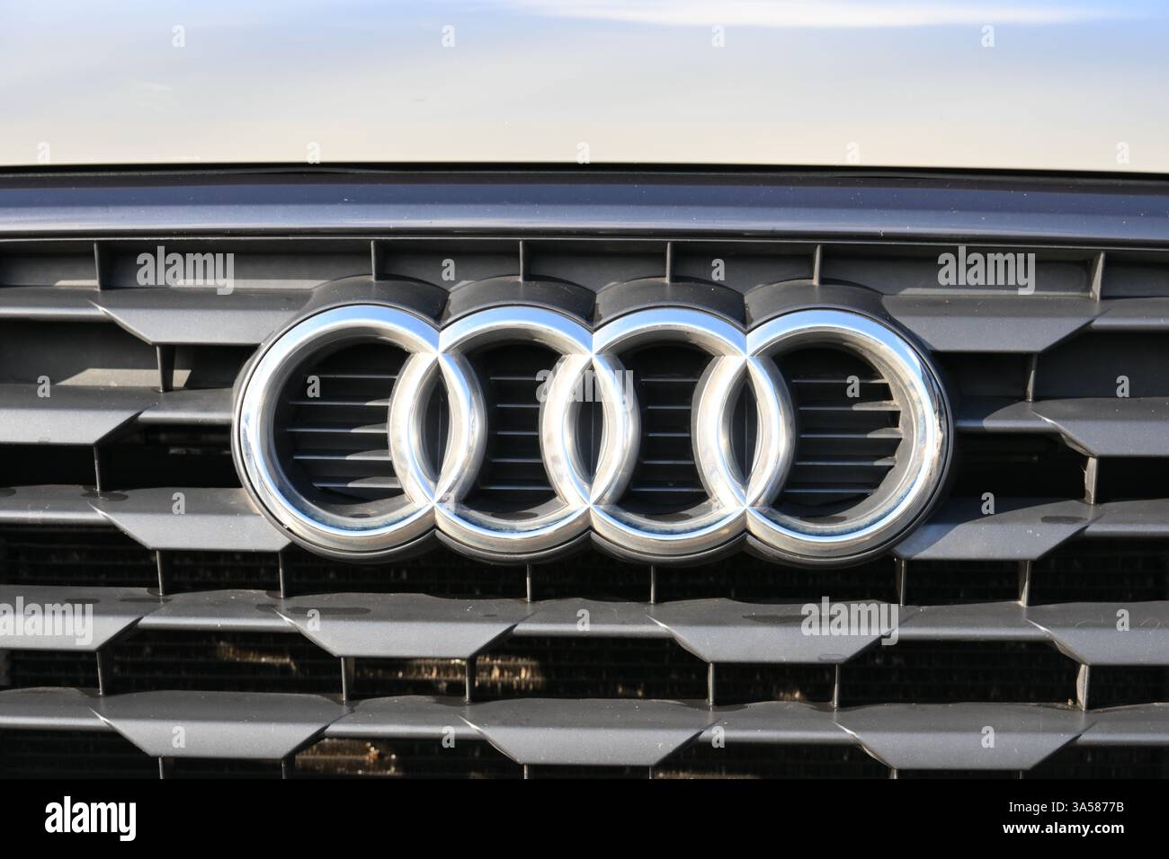 Audi Logo Emblem on the front grille of a Car Stock Photo - Alamy