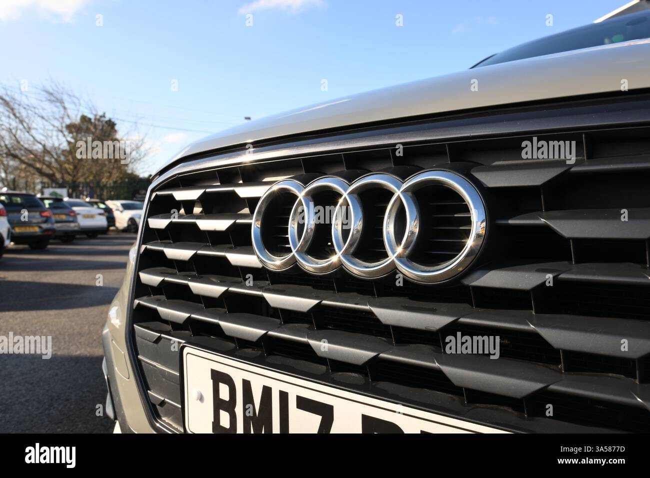 Audi Logo Emblem on the front grille of a Car Stock Photo - Alamy