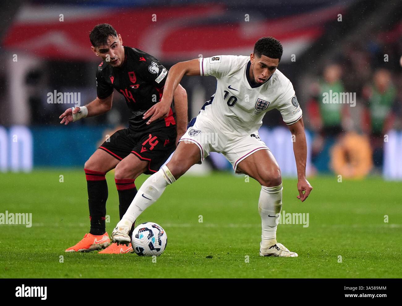 England's Jude Bellingham and Albania's Qazim Laci (left) during the ...