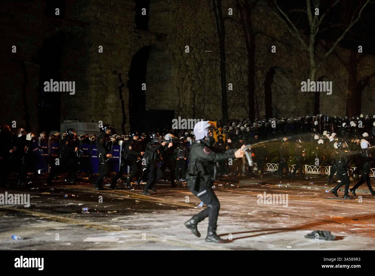 Police officers use pepper spray and an anti riot rifles to disperse ...