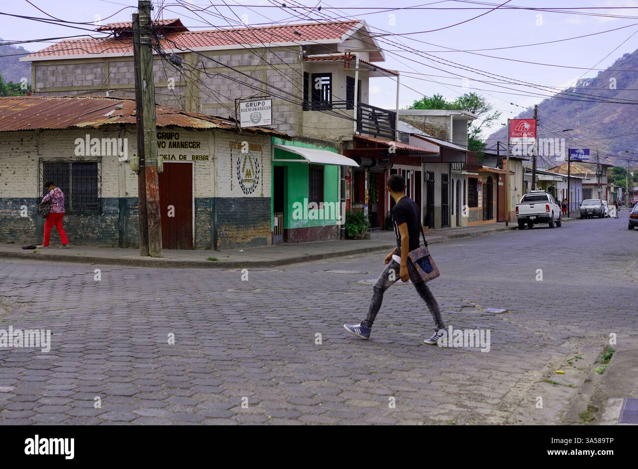 View down a Nicaraguan street facing north with a Alcoholics Anonymous ...