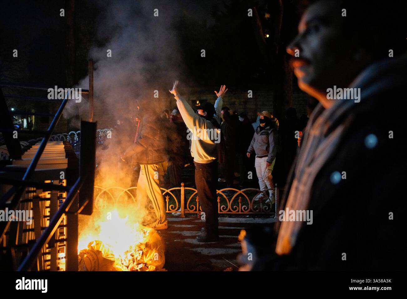 Protesters shout slogans during clashes with anti riot police during a ...