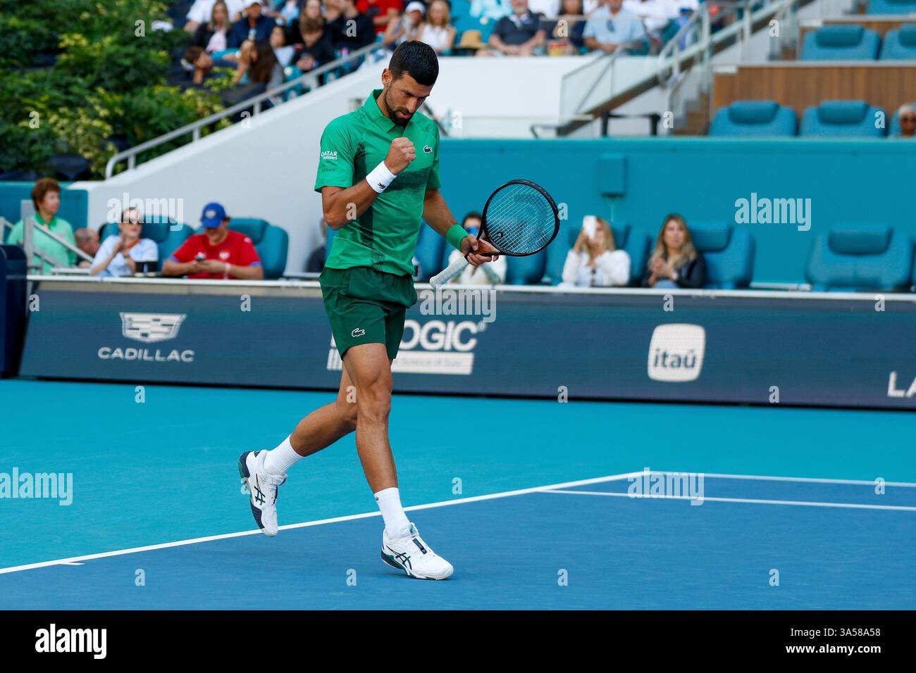 MIAMI GARDENS, FL - MARCH 21: Novak Djokovic (SRB) in action during his ...