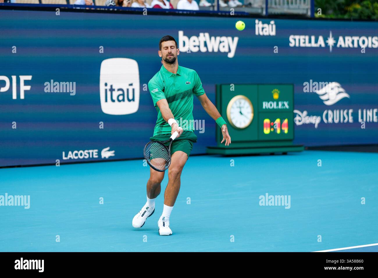 MIAMI GARDENS, FL - MARCH 21: Novak Djokovic (SRB) in action during his ...