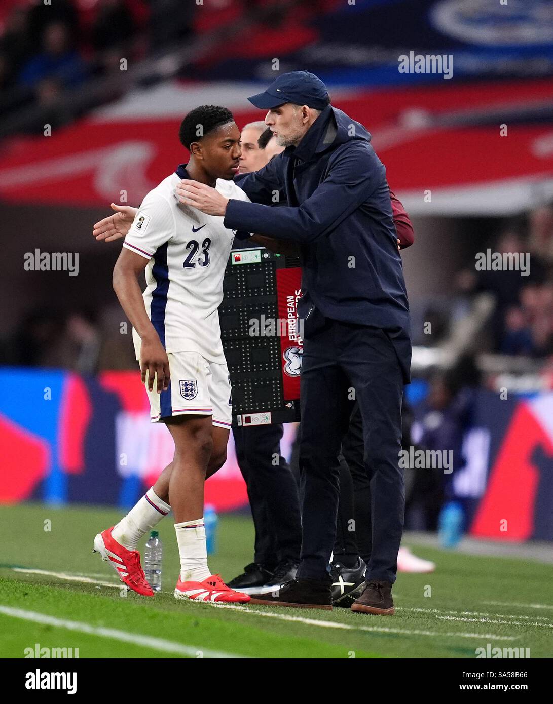 England manager Thomas Tuchel with Myles Lewis-Skelly as he is ...