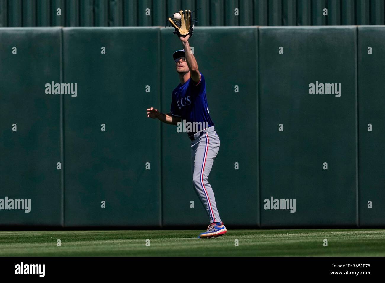 Texas Rangers' Evan Carter catches a sacrifice fly hit by Los Angeles ...