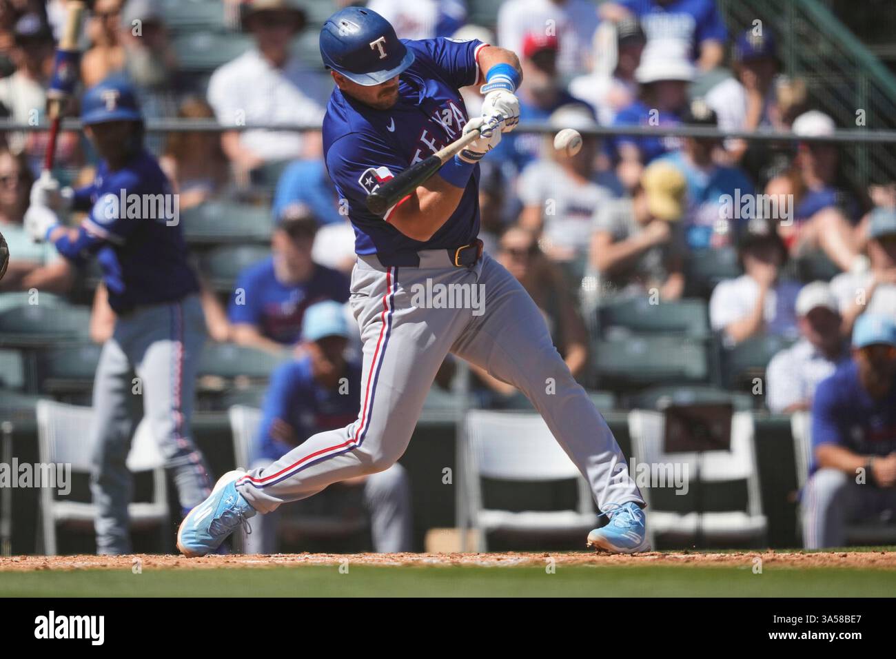 Texas Rangers' Jake Burger connects for a base hit during the fourth ...
