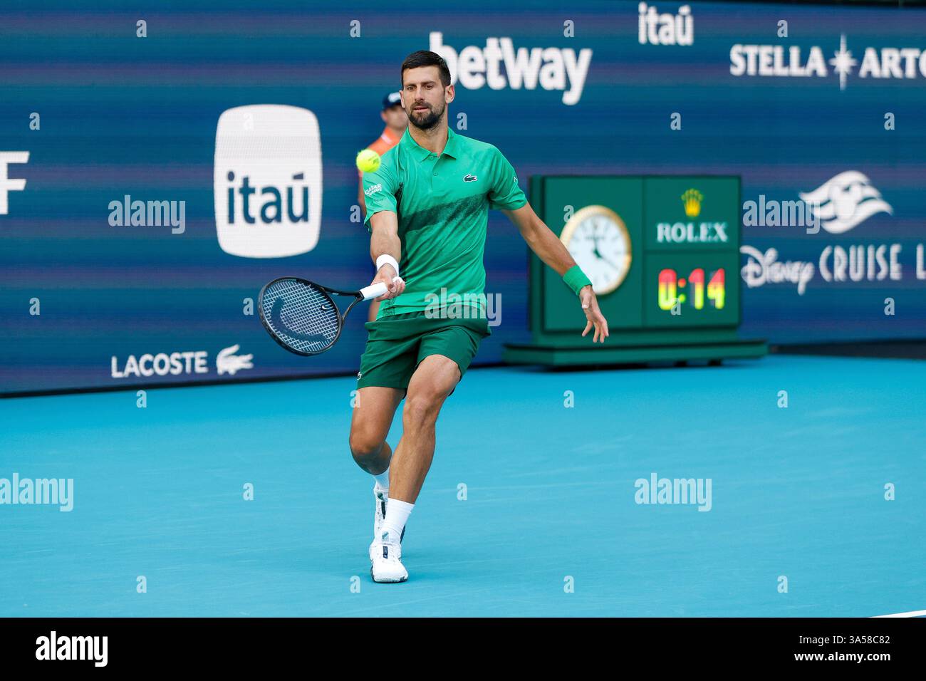 MIAMI GARDENS, FL - MARCH 21: Novak Djokovic (SRB) in action during his ...