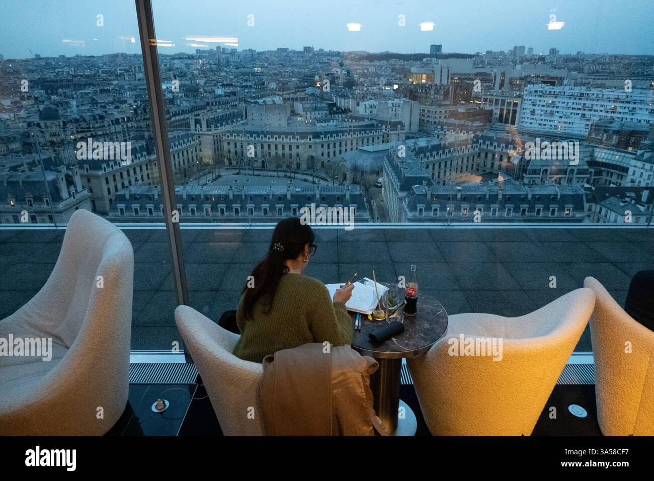 March 21, 2025, Paris, France: A woman sits in the rooftop bar Bonnie ...