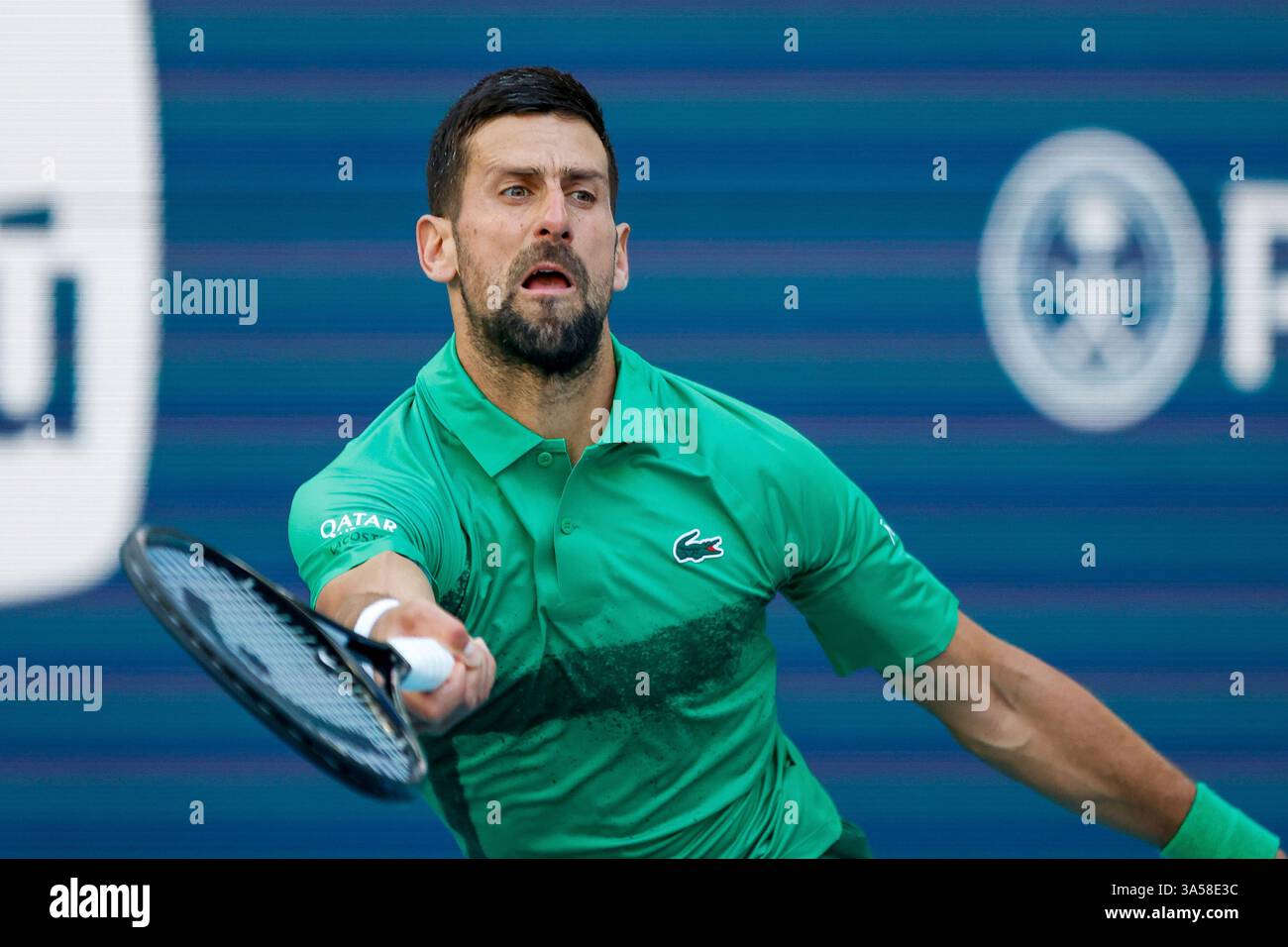 MIAMI GARDENS, FL - MARCH 21: Novak Djokovic (SRB) in action during his ...