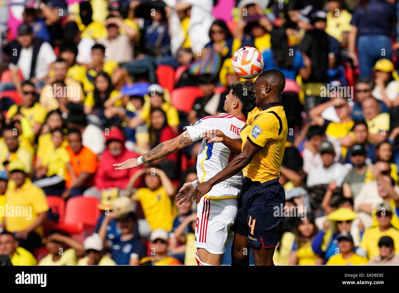 Venezuela's Samuel Sosa, left, and Ecuador's Joel Ordonez go for a ...