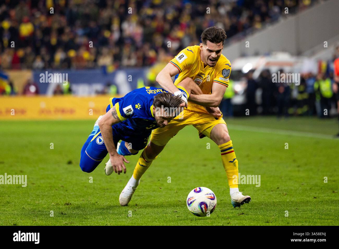 Ianis Hagi of Romania and Ermin Bicakcic of Bosnia and Herzegovina ...