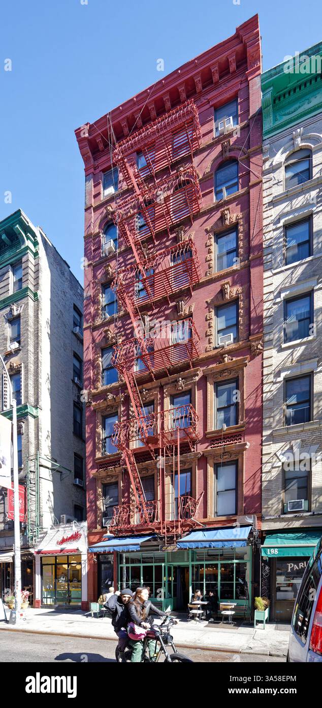 200 Mott Street is a red roman brick apartment building with tan terra ...