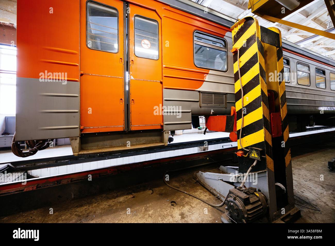 Carriage of electric train at service on jack screw in train repair ...