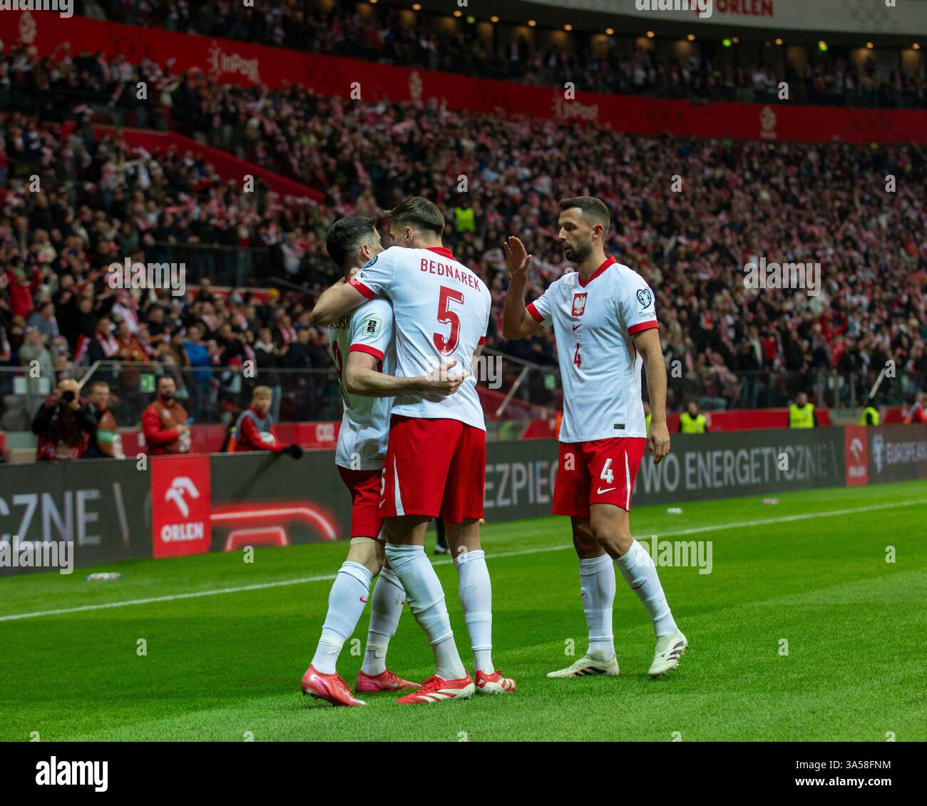 Robert Lewandowski of Poland celebrates scoring with Jan Bednarek of ...