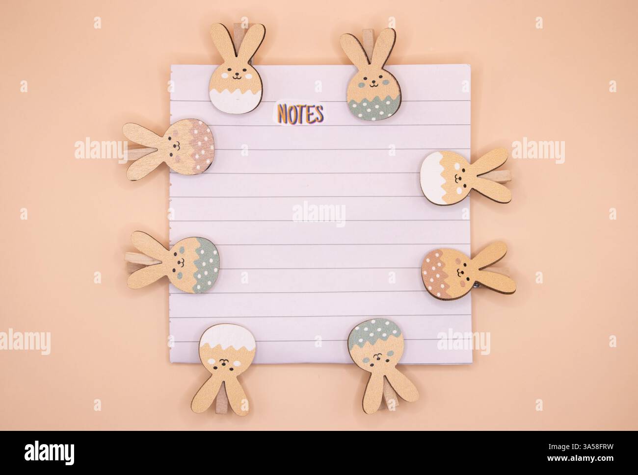 An Easter composition with a blank notebook sheet labeled 'Notes ...