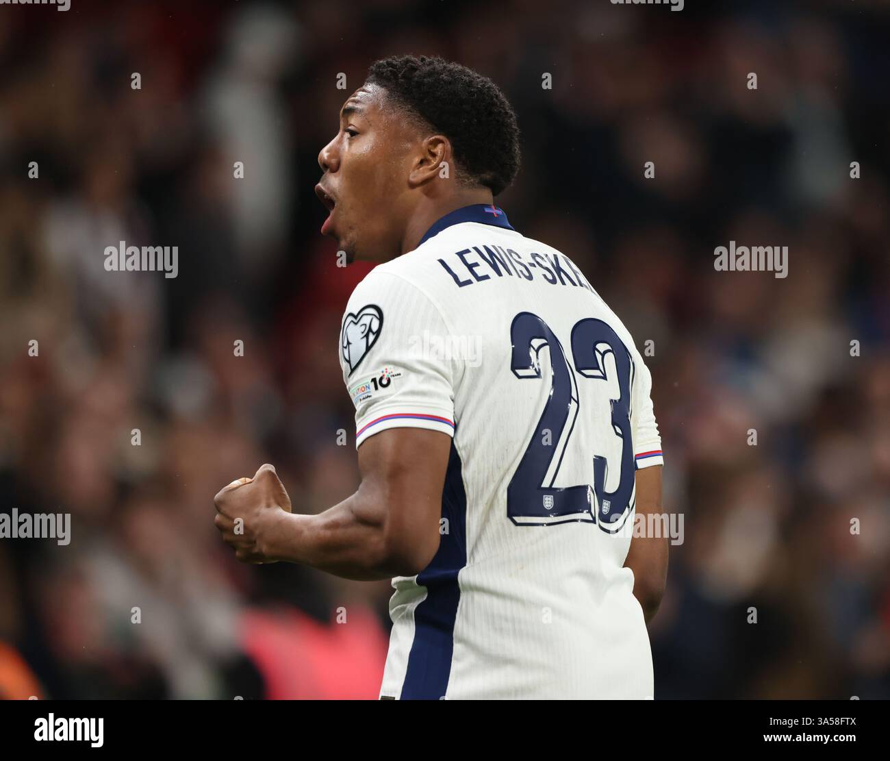 London, UK. 21st Mar, 2025. Myles Lewis-Skelly (E) celebrates scoring ...