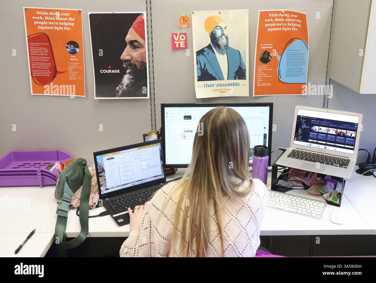 A New Democratic Party campaign team member works at the NDP ...